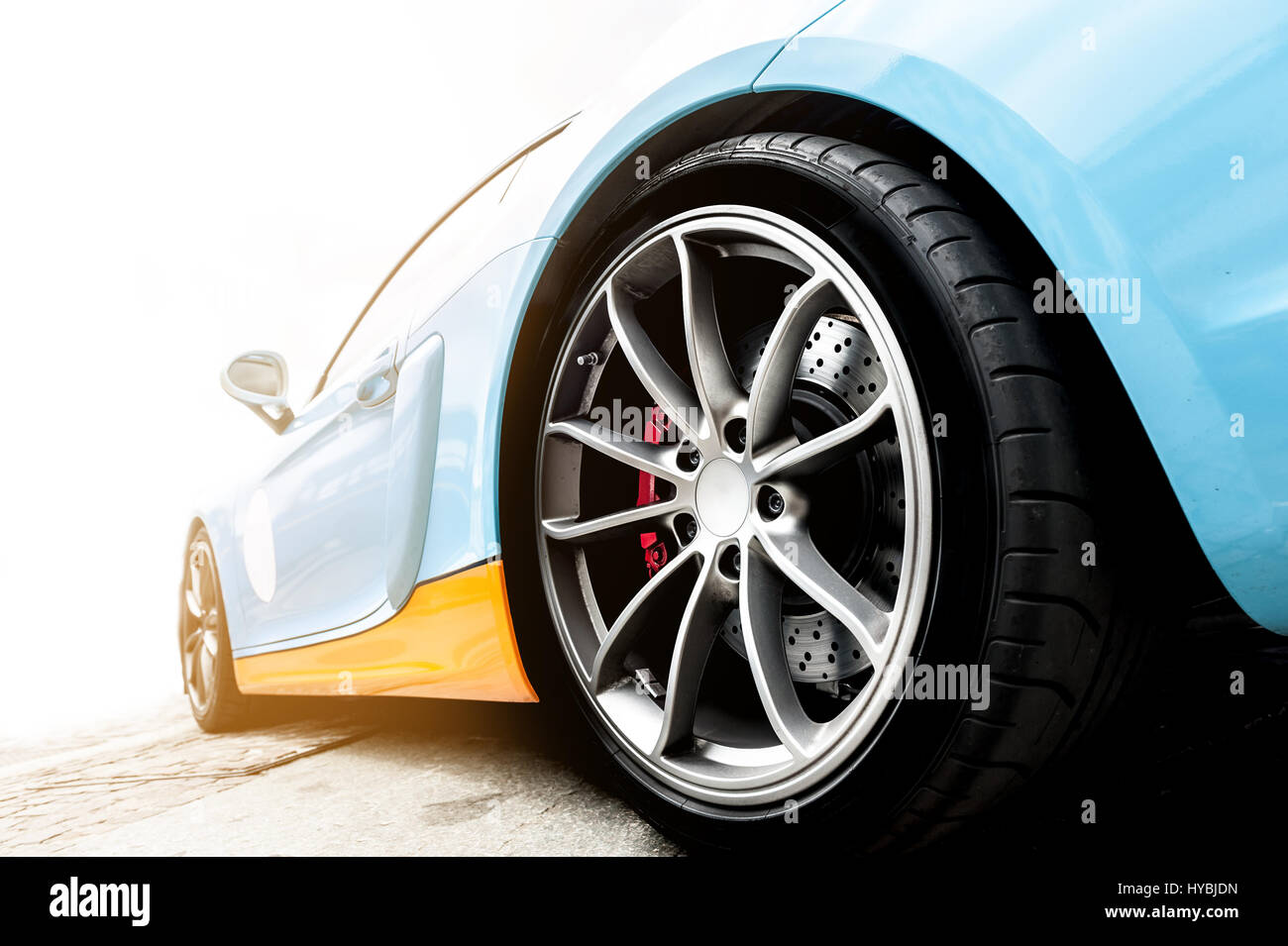 Back of a blue modern sport car in sunset Stock Photo - Alamy