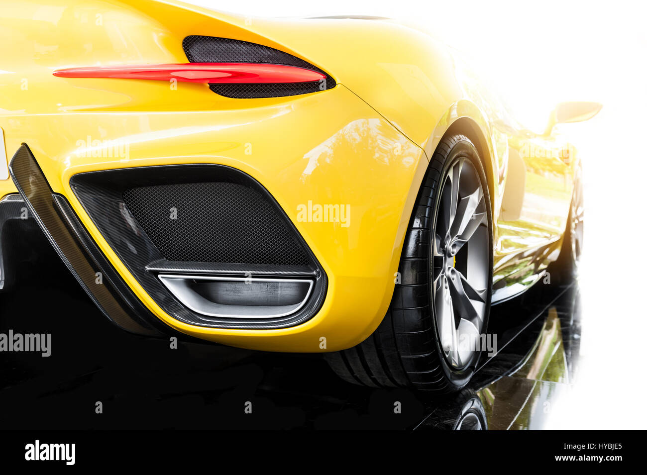 Back of a yellow modern sport car in sunset Stock Photo - Alamy