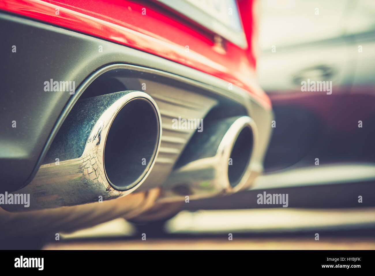 Close up of a car dual exhaust pipe Stock Photo - Alamy