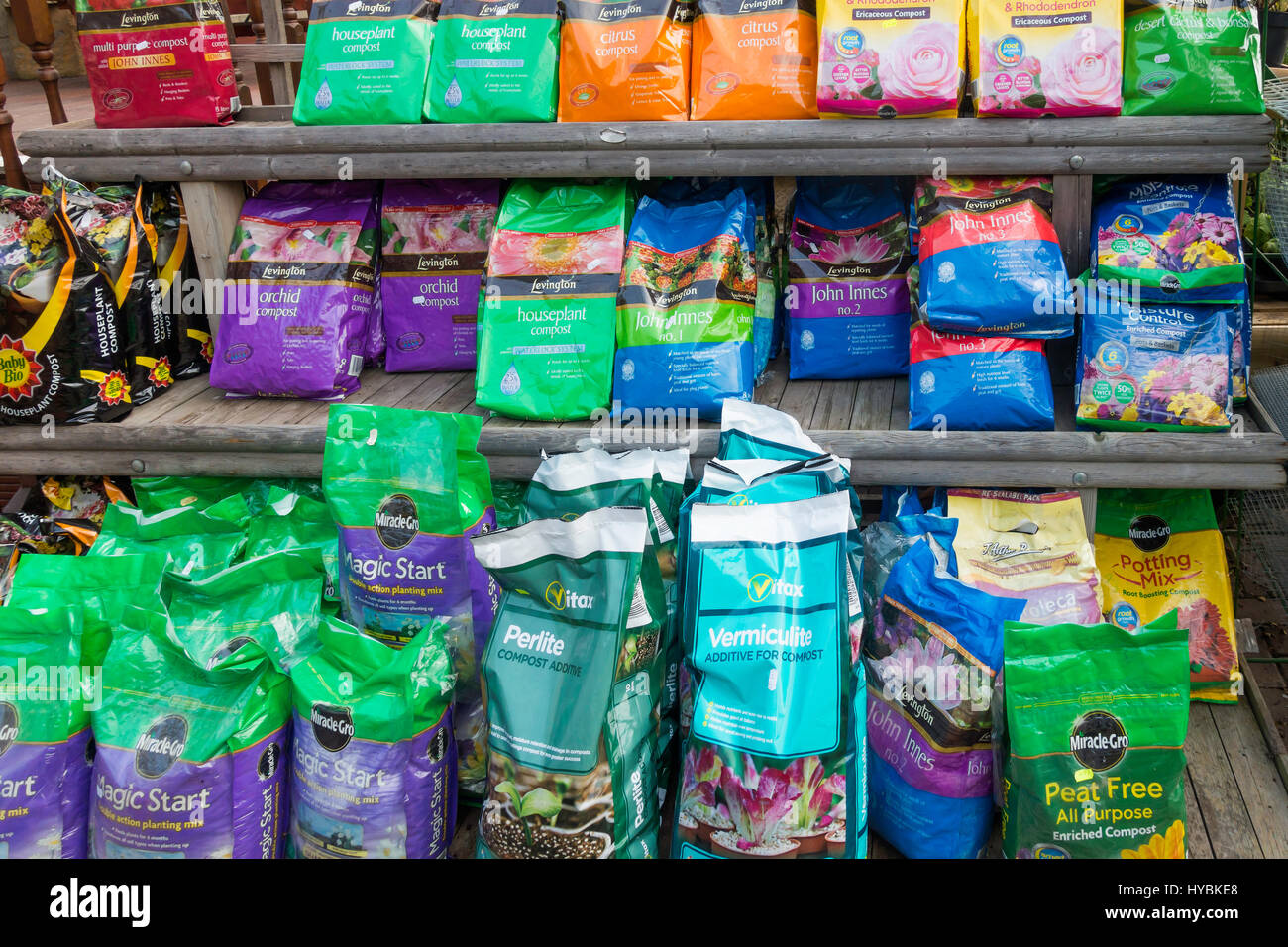 A garden centre display showing the many types of compost available for ...
