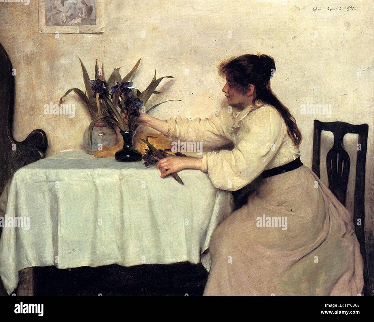 In *Arranging the Irises* (1897), *Edwin Harris* captures the delicate ...