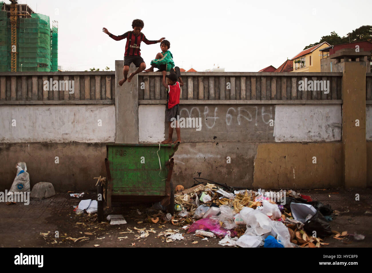 children jumping on garbage, phnom penh, cambodia Stock Photo - Alamy