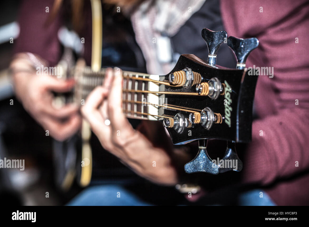 female musician playing the electric bass Stock Photo - Alamy