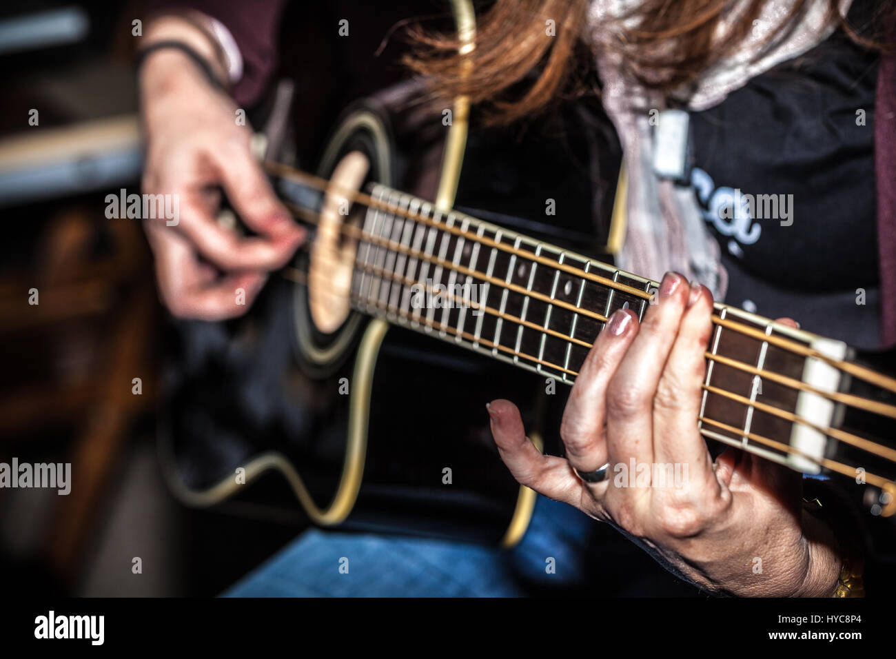 female musician playing the electric bass Stock Photo - Alamy