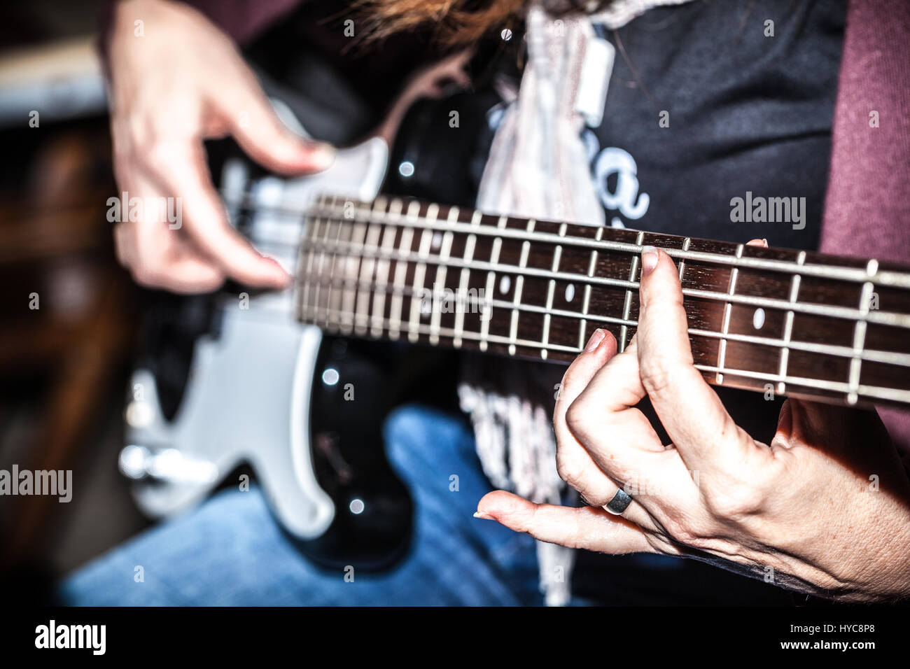 female musician playing the electric bass Stock Photo - Alamy