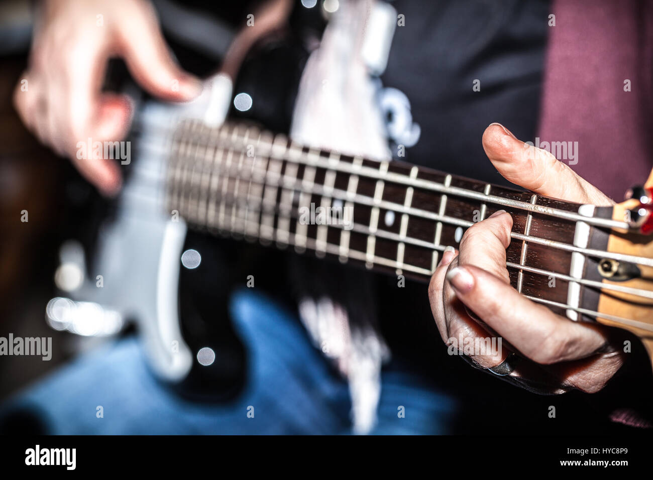 female musician playing the electric bass Stock Photo - Alamy