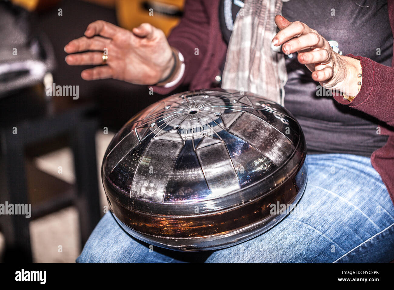 woman playing the tank drum Stock Photo - Alamy