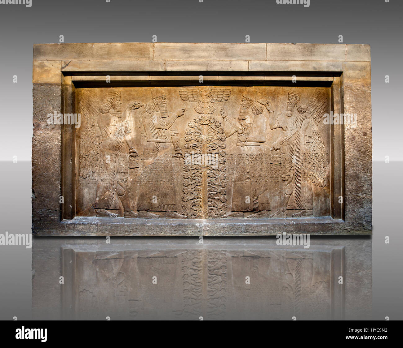 Assyrian relief sculpture panel of King Ashurnasirpal II dressed in ...