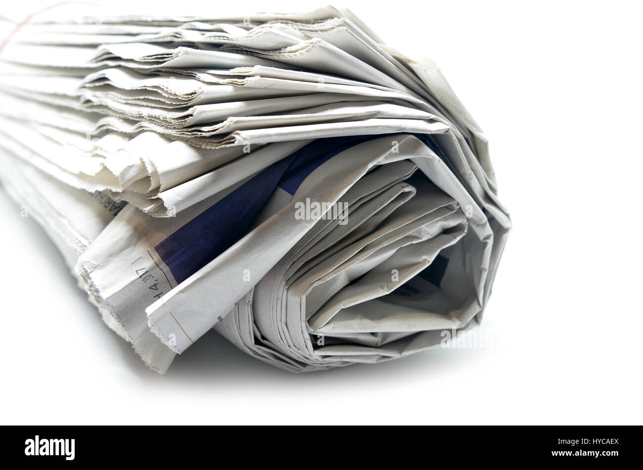 Roll of newspapers, isolated on white background Stock Photo - Alamy