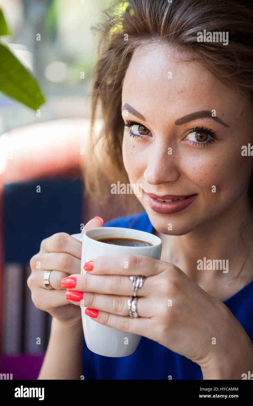 Woman drinking a cup of coffee. Coffee drinker Stock Photo - Alamy