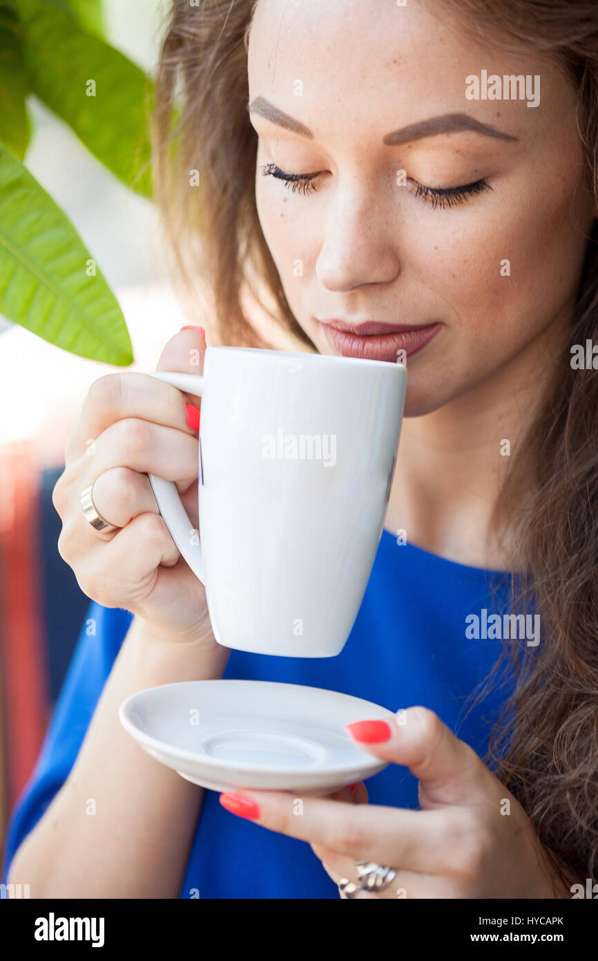 Young beautiful woman drinking a cup of coffee. Coffee drinker Stock ...