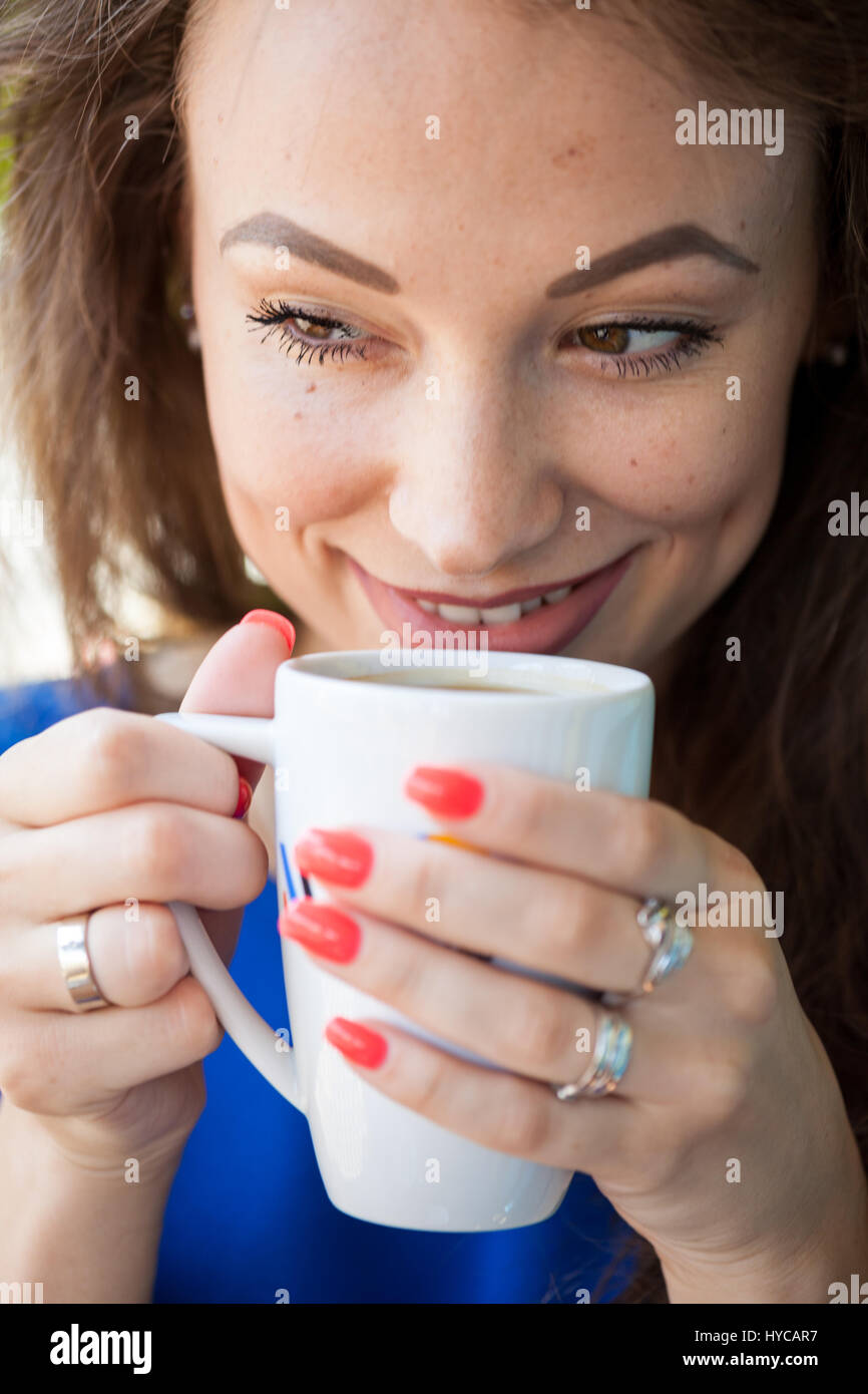 Beautiful young woman drinking a cup of coffee. Coffee drinker Stock ...