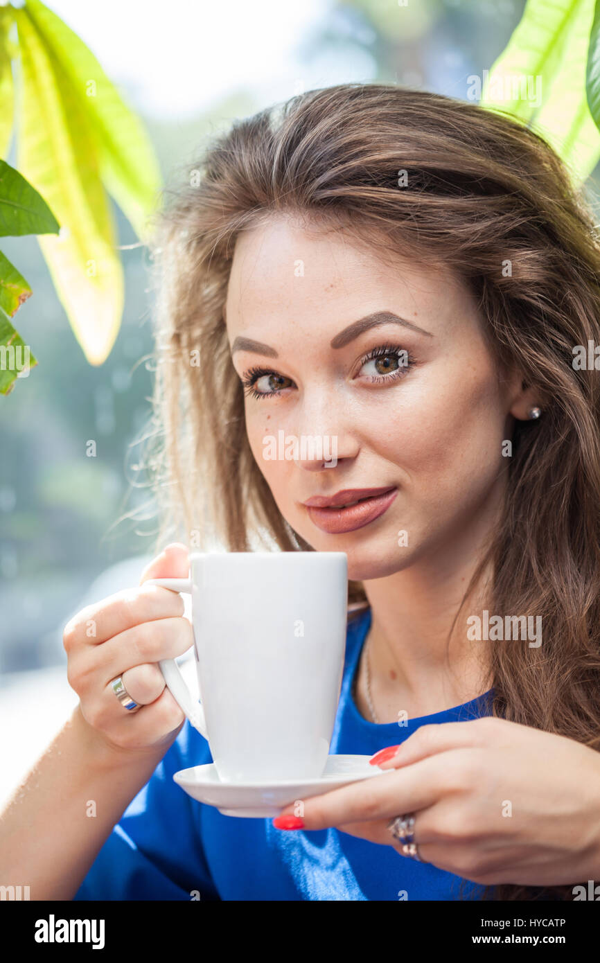 Beautiful woman drinking a cup of coffee. Coffee drinker Stock Photo ...
