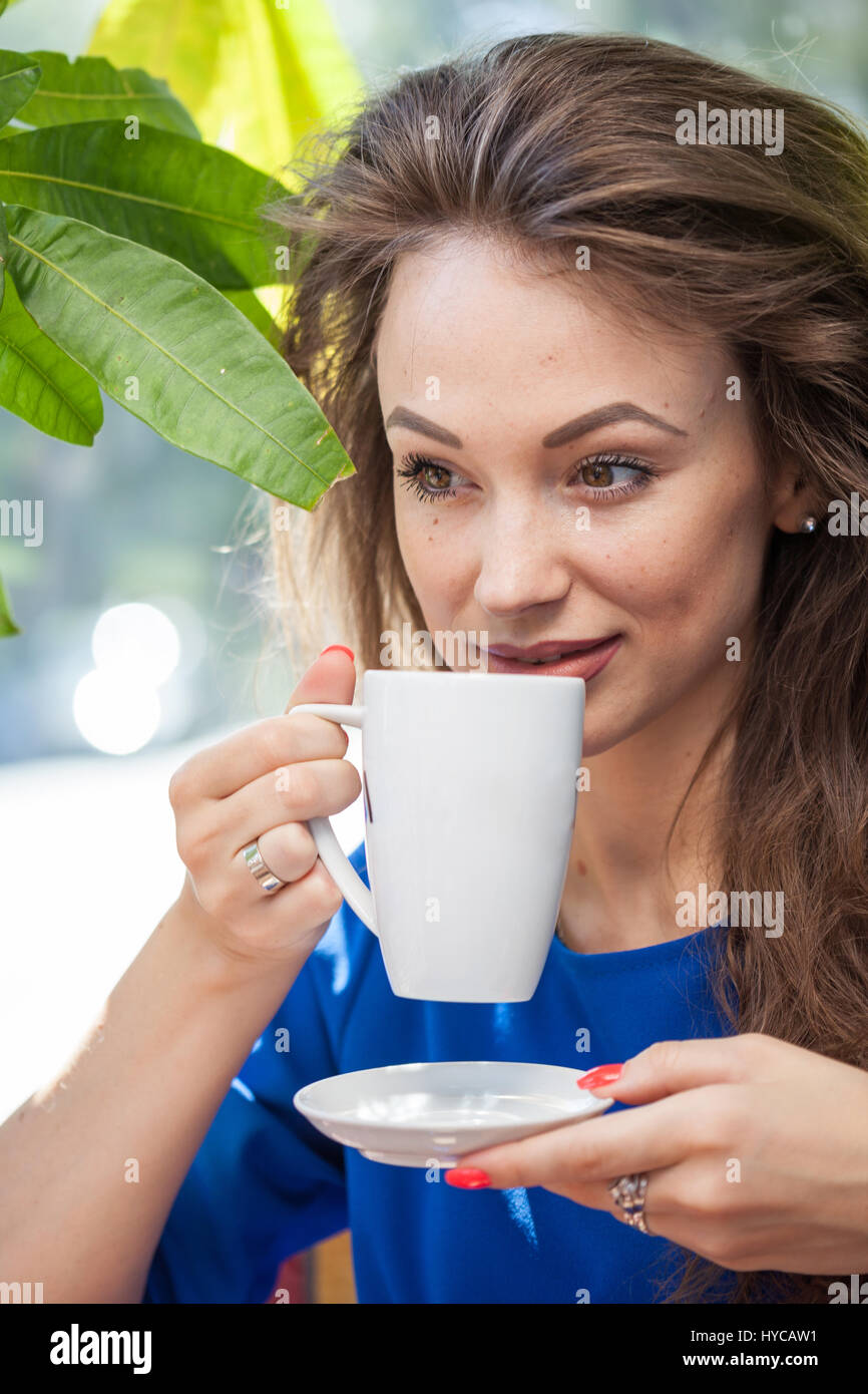 Beautiful woman drinking a cup of coffee. Coffee drinker Stock Photo ...