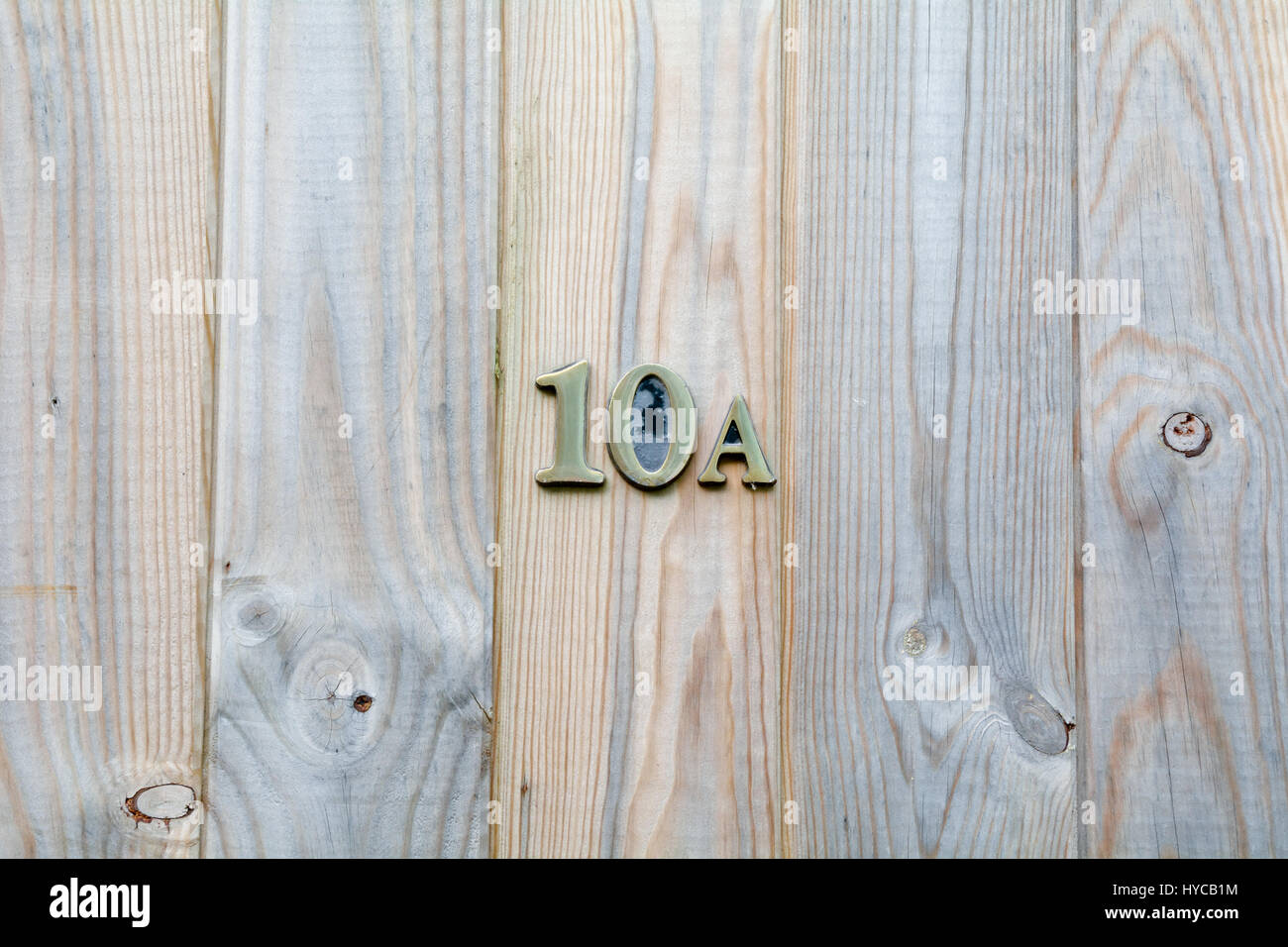 House number 10A sign on wooden fence Stock Photo - Alamy