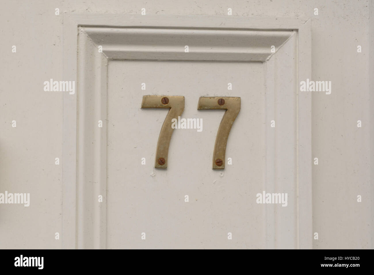 House number 77 sign on door Stock Photo - Alamy