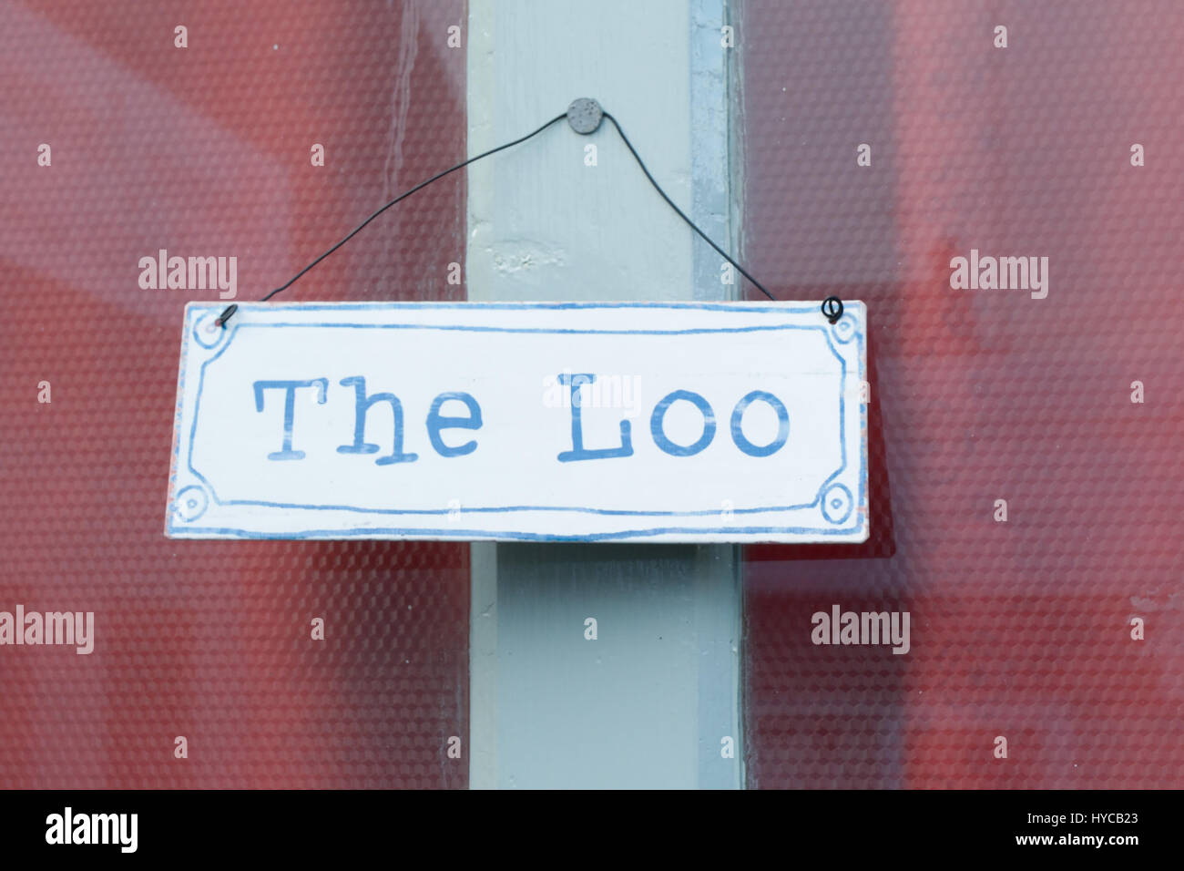 The Loo - hanging sign on toilet door open to the public Stock Photo ...