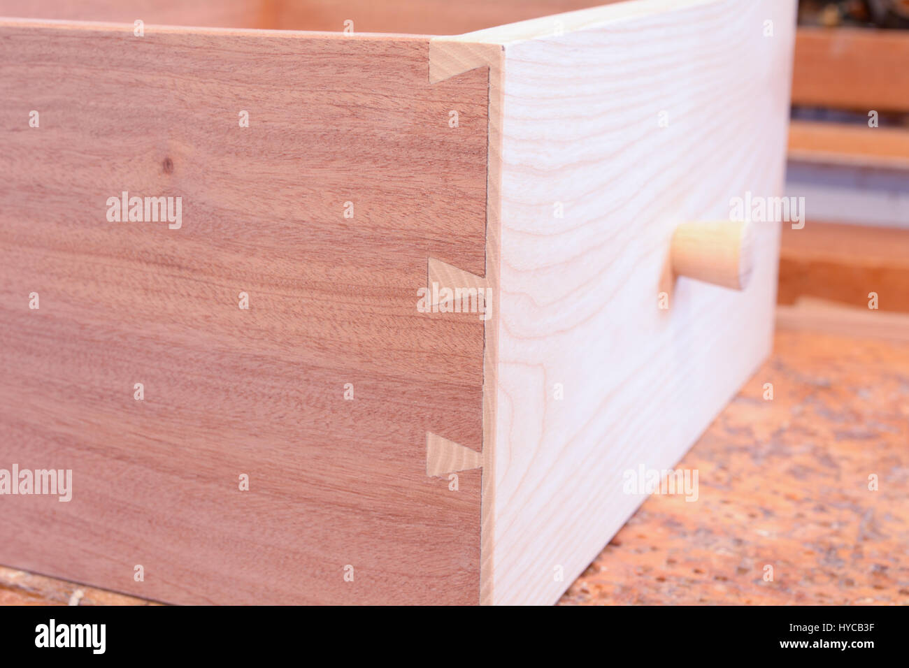 Dovetail joints on wooden drawer in carpenters workshop Stock Photo - Alamy
