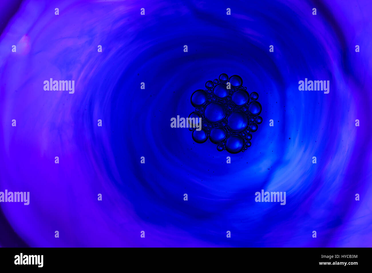 moving ink in water spiral abstract Stock Photo - Alamy