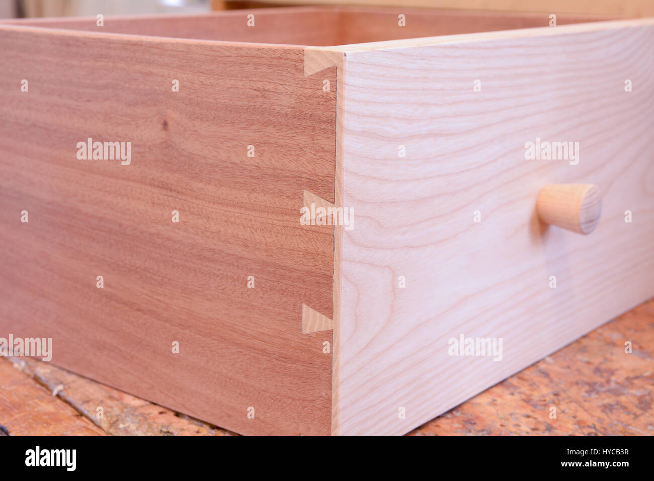Dovetail joints on wooden drawer in carpenters workshop Stock Photo - Alamy