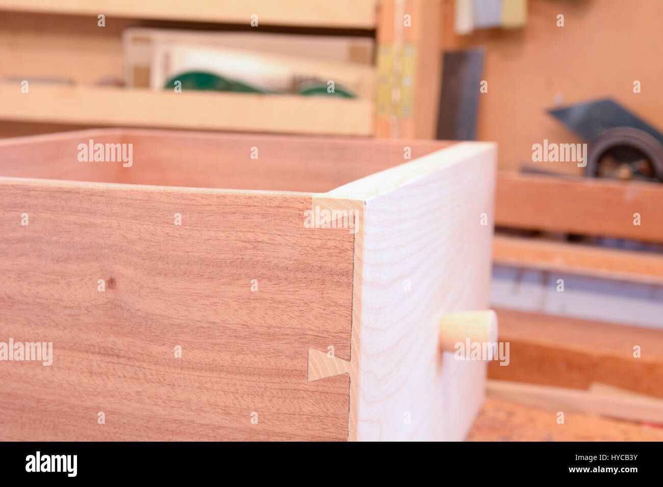 Dovetail joints on wooden drawer in carpenters workshop Stock Photo - Alamy
