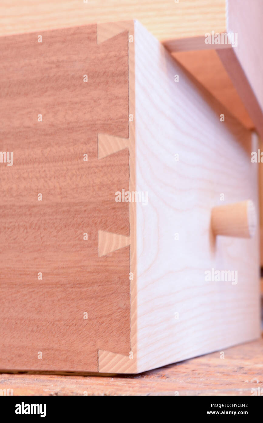 Dovetail joints on wooden drawer in carpenters workshop hi-res stock ...