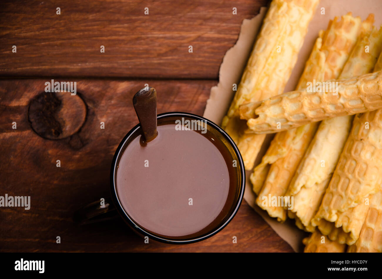 tubular wafer. waffles on wooden boards. hot chocolate Stock Photo - Alamy