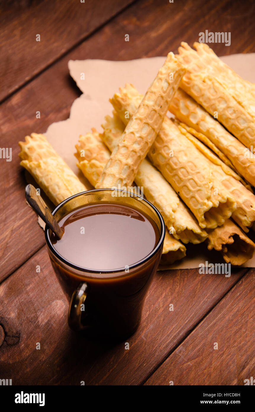 tubular wafer. waffles on wooden boards. hot chocolate Stock Photo - Alamy
