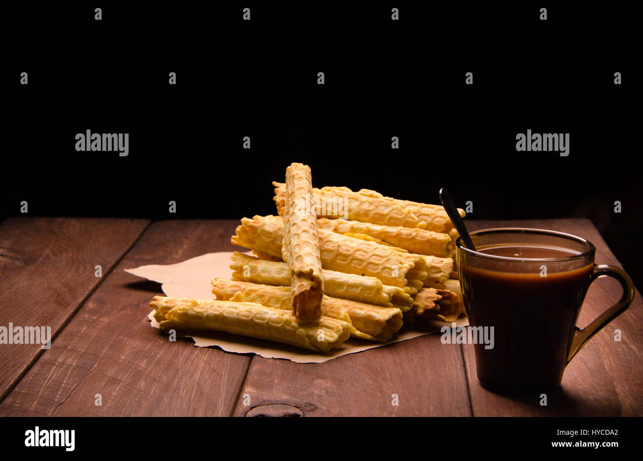 tubular wafer. waffles on wooden boards. hot chocolate Stock Photo - Alamy