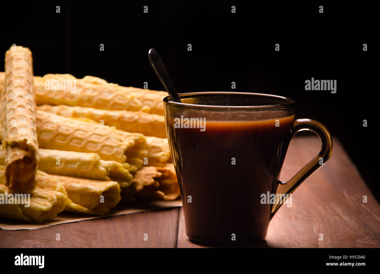 tubular wafer. waffles on wooden boards. hot chocolate Stock Photo - Alamy
