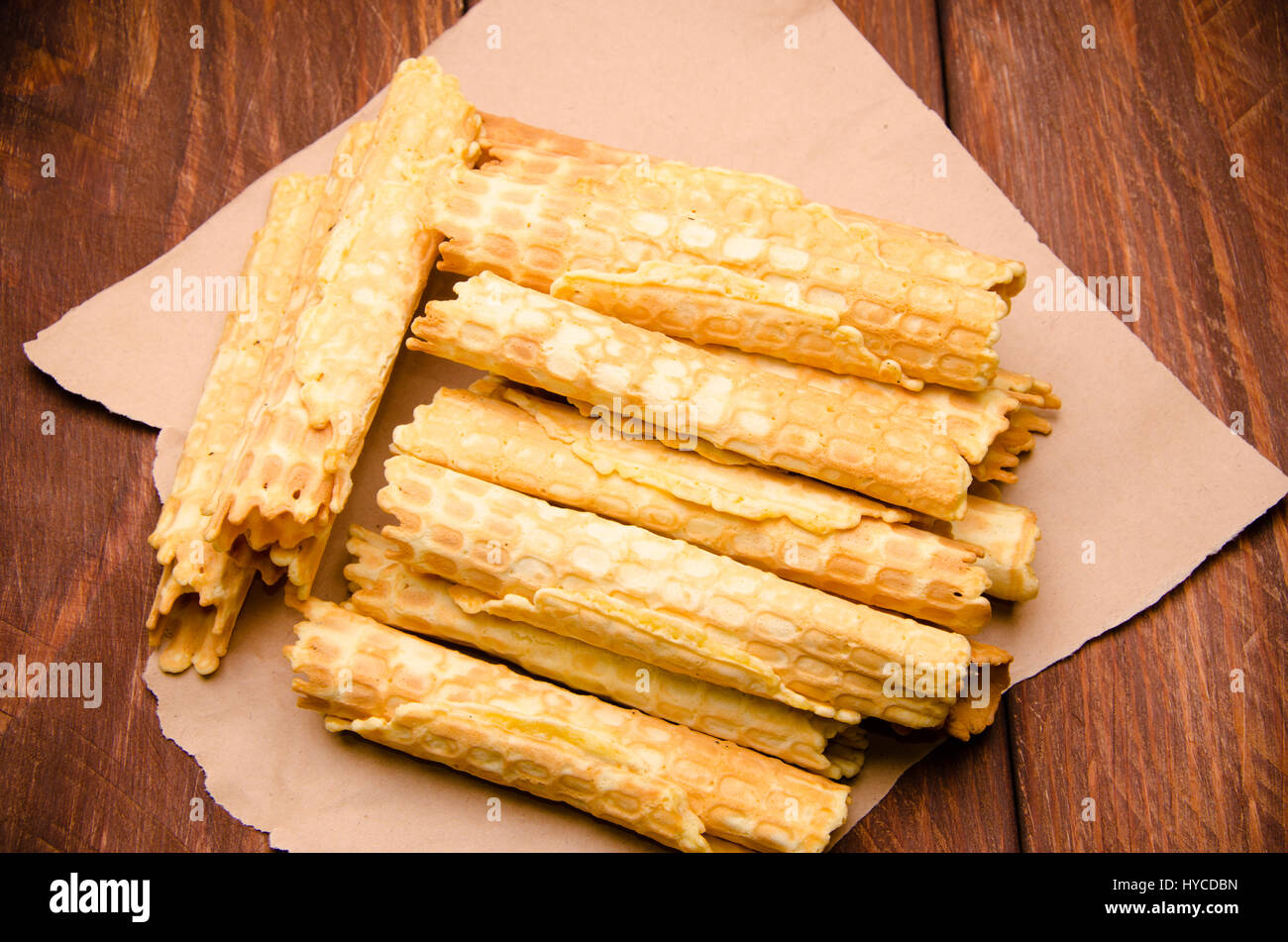 tubular wafer. waffles on Kraft paper. waffles on wooden boards Stock ...