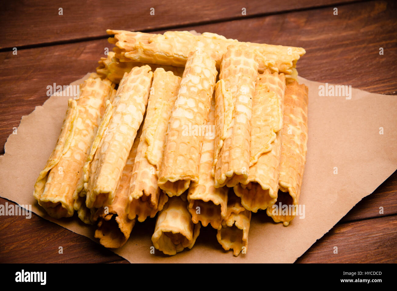tubular wafer. waffles on Kraft paper. waffles on wooden boards Stock ...