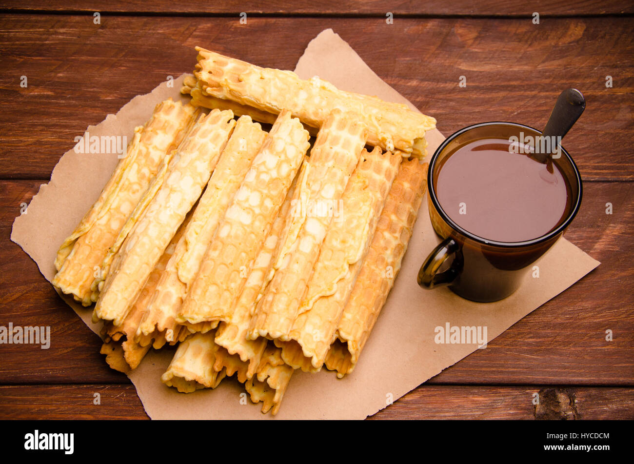 tubular wafer. waffles on wooden boards. hot chocolate Stock Photo - Alamy