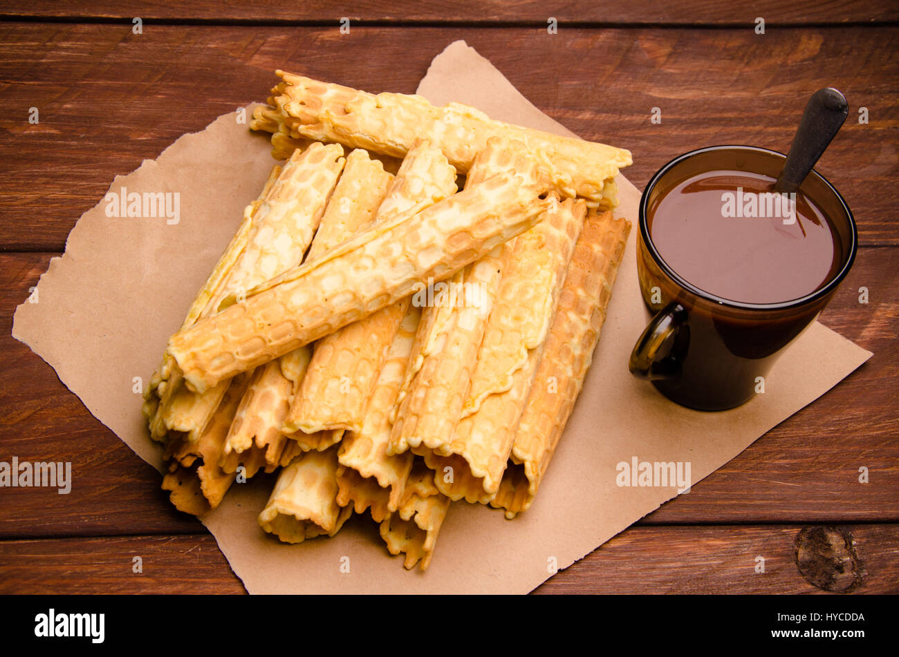 tubular wafer. waffles on wooden boards. hot chocolate Stock Photo - Alamy
