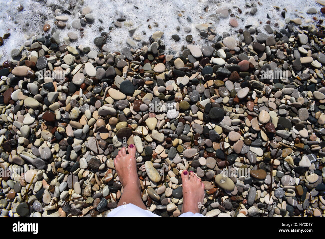 Feet on pebbles hi-res stock photography and images - Alamy