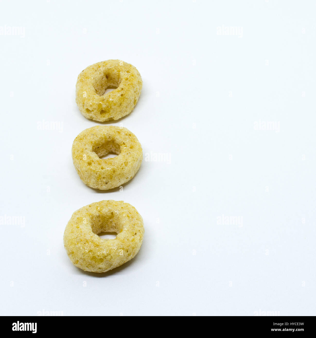 Closeup of Three Cheerios on White Background Stock Photo - Alamy