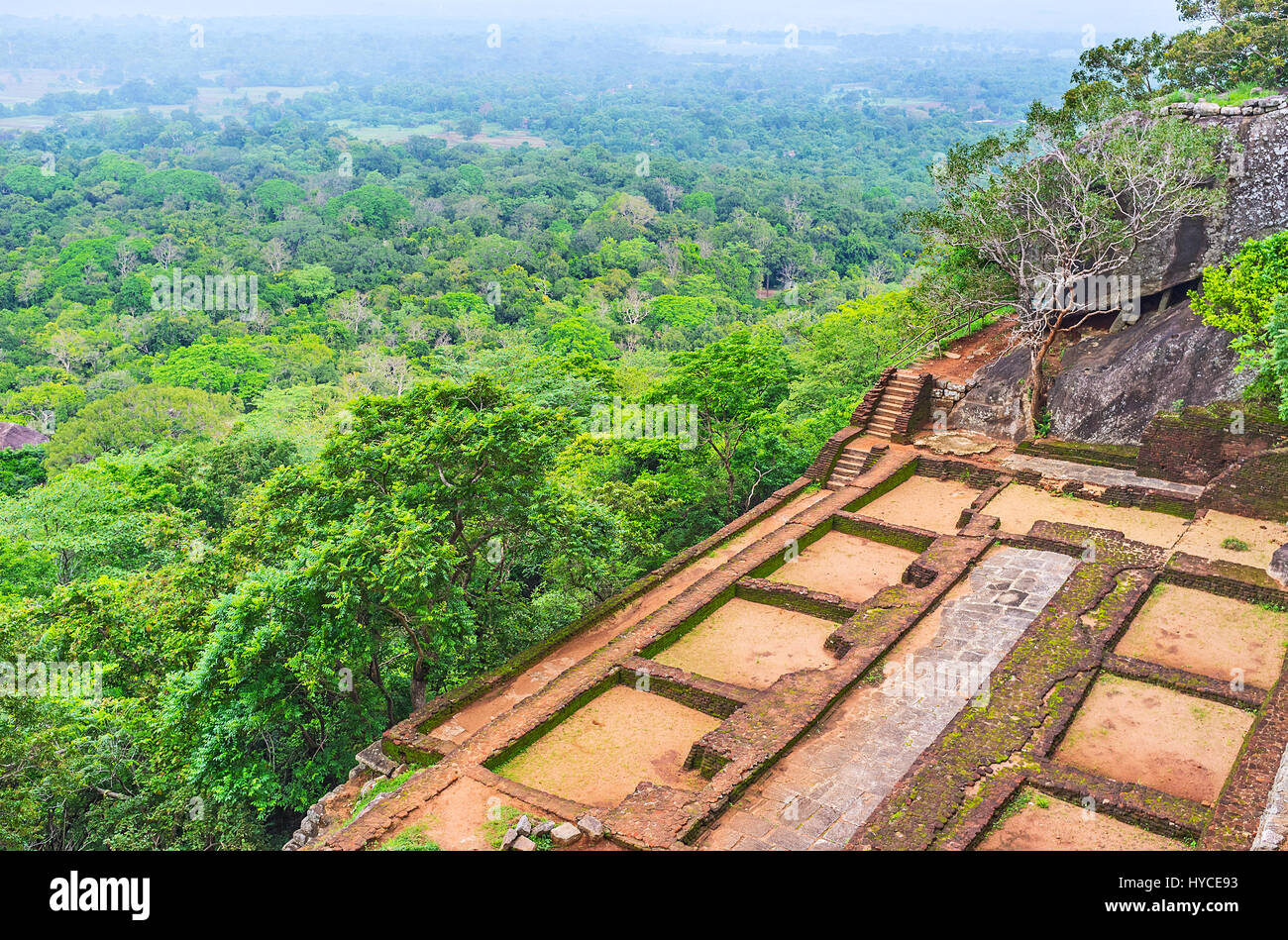 The foundations of the ancient buildings on the slope of the rock, on ...