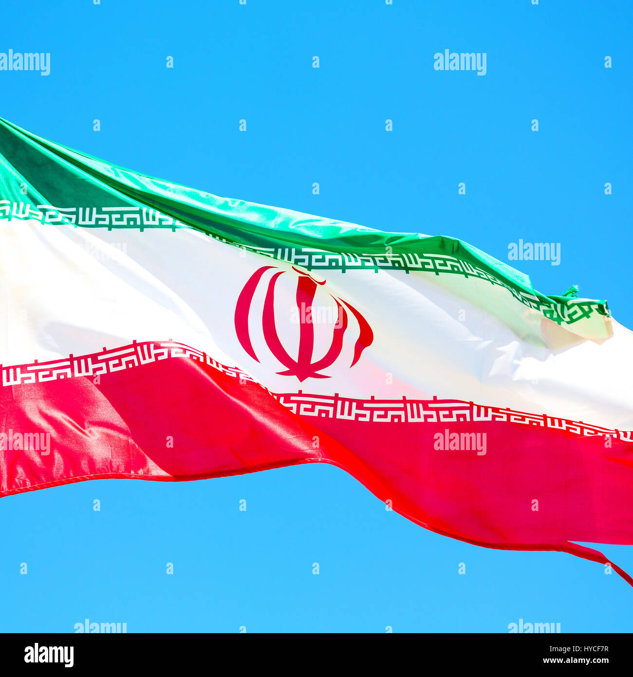 in iran iranian waving flag the blue sky and wind Stock Photo - Alamy