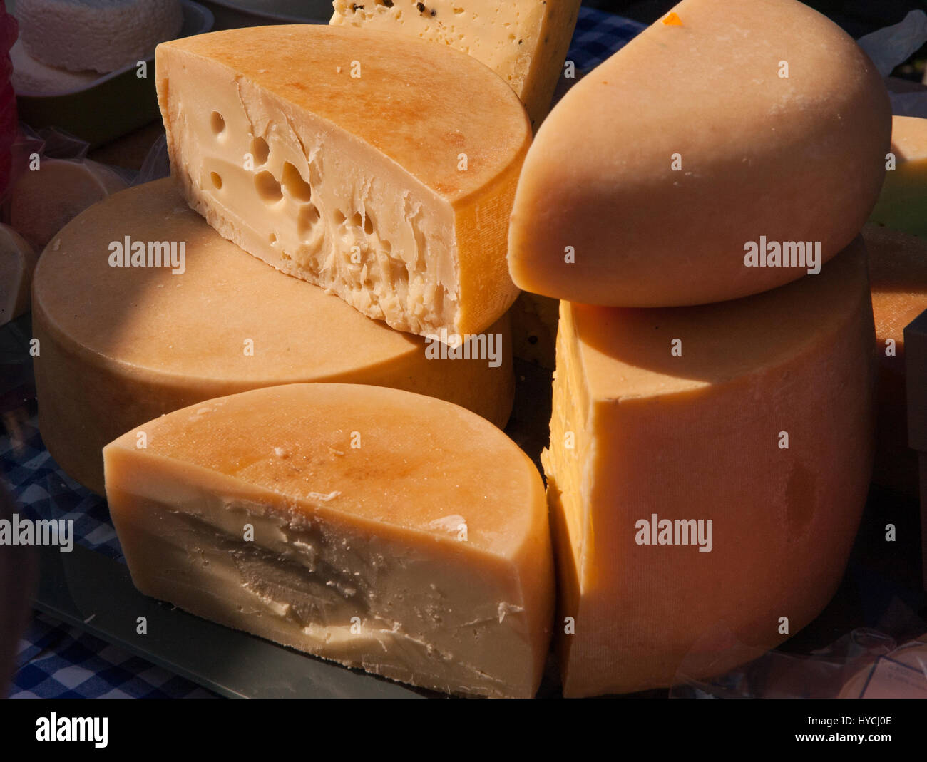 Cheese wheels sold at the farmers market Stock Photo - Alamy