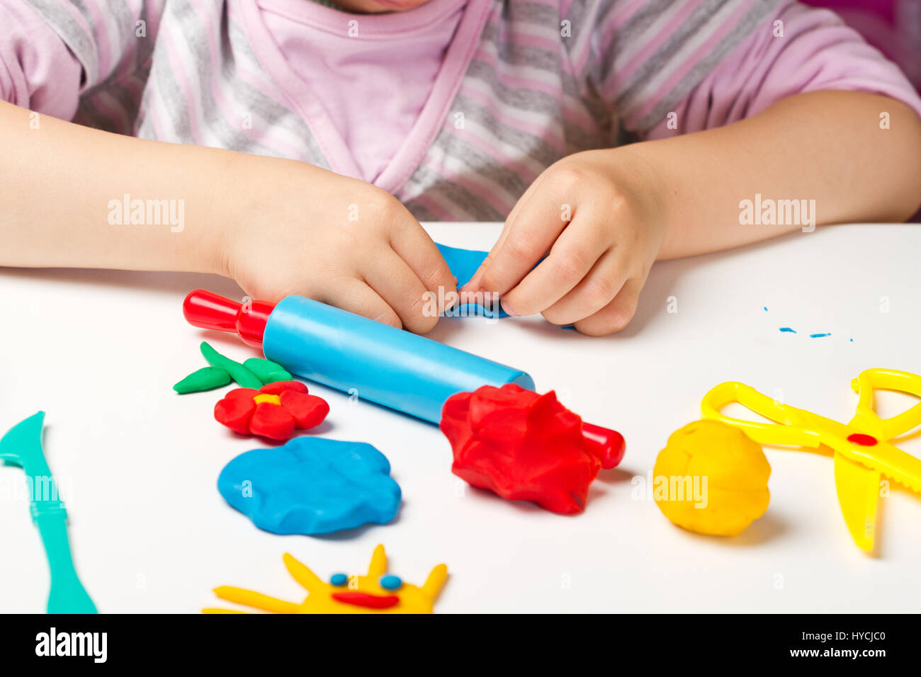 Child hands playing with colorful clay Stock Photo - Alamy