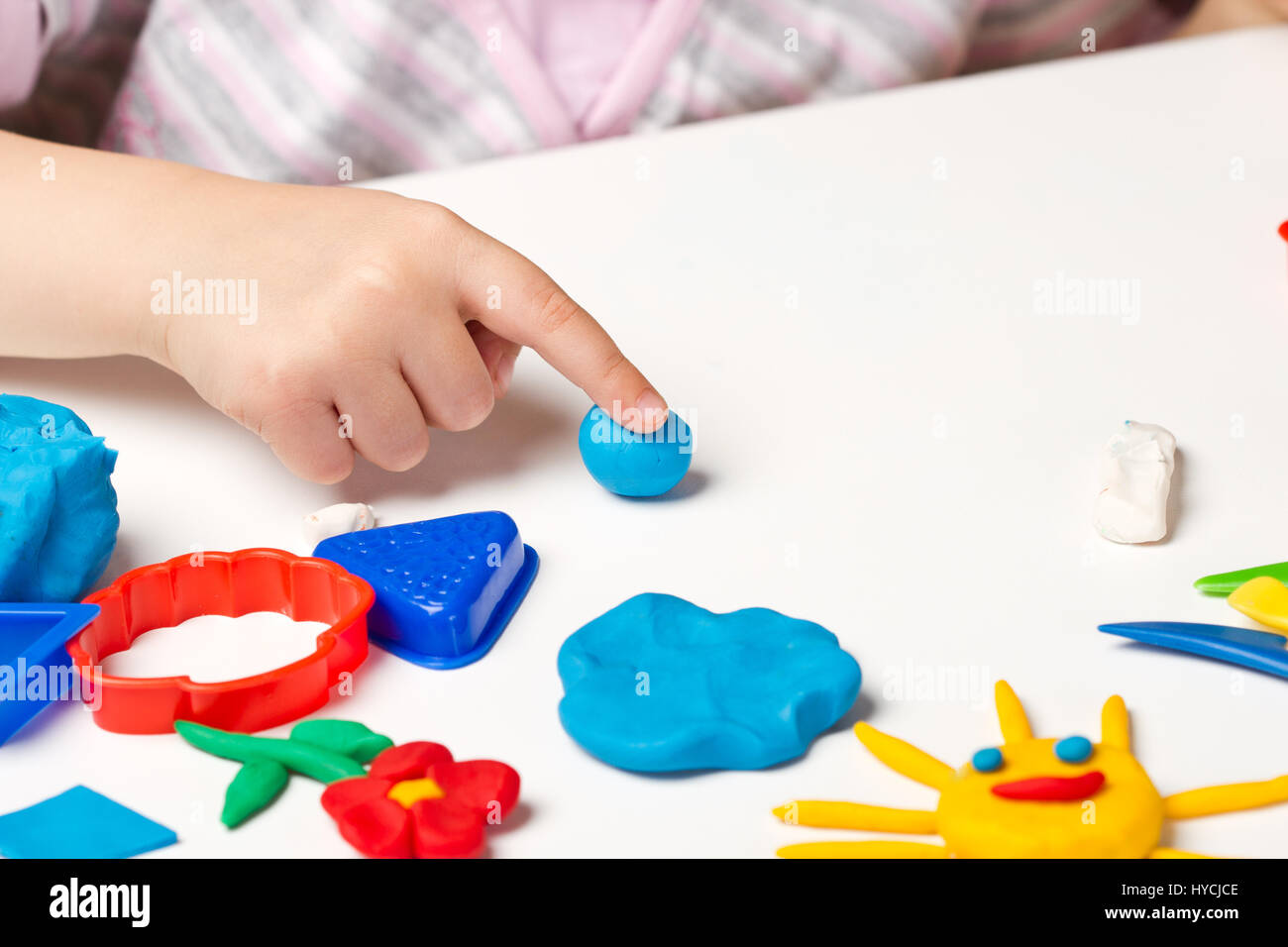 Child hands playing with colorful clay Stock Photo - Alamy