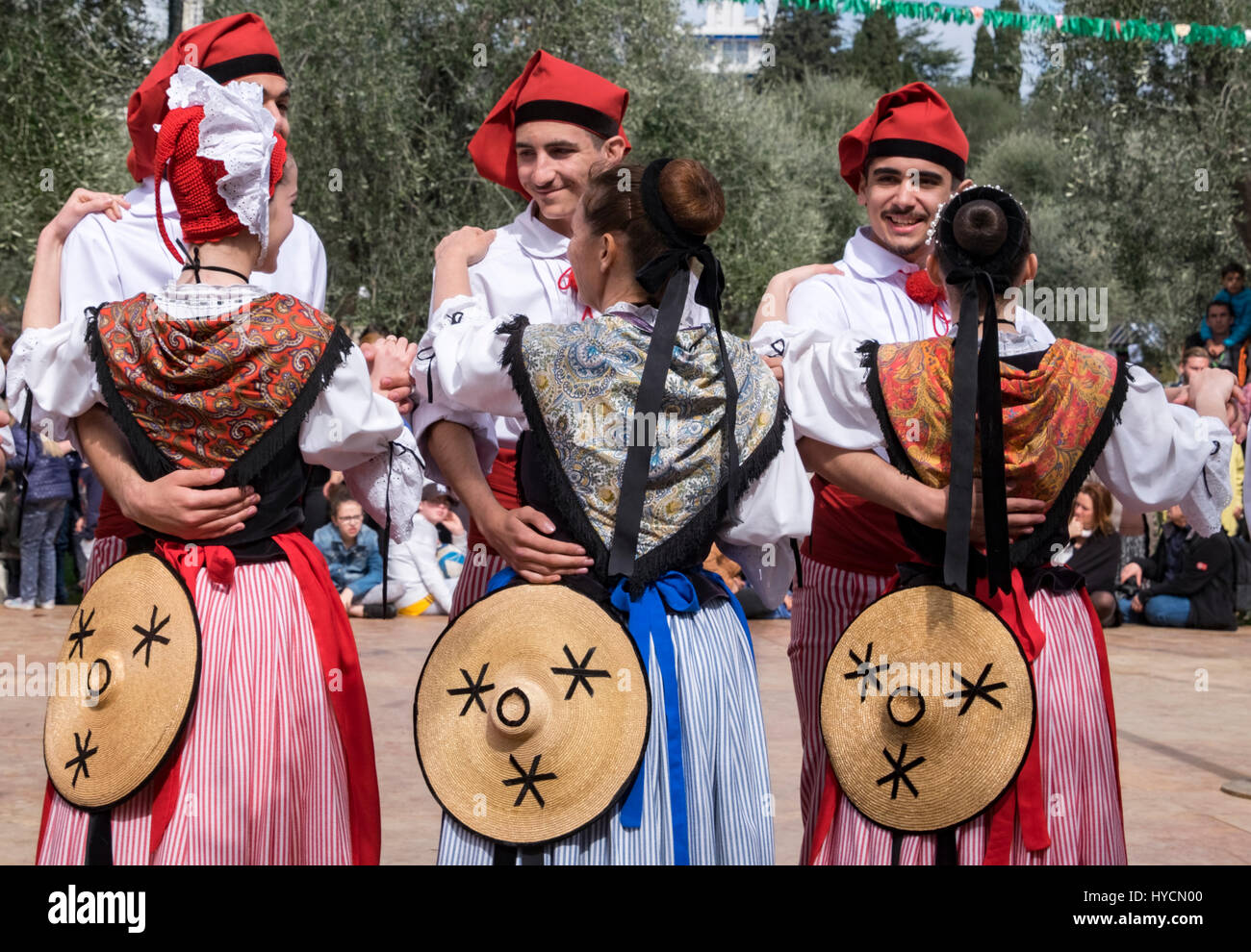 Folk dancers in the traditional costumes of Nice prepare to dance at a ...