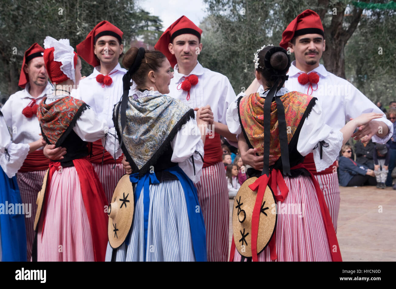 Folk dancers in the traditional costumes of Nice prepare to dance at a ...