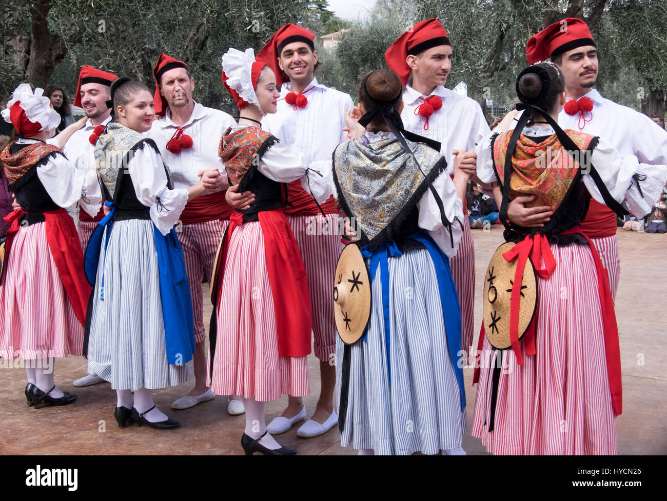 Folk dancers in the traditional costumes of Nice prepare to dance at a ...