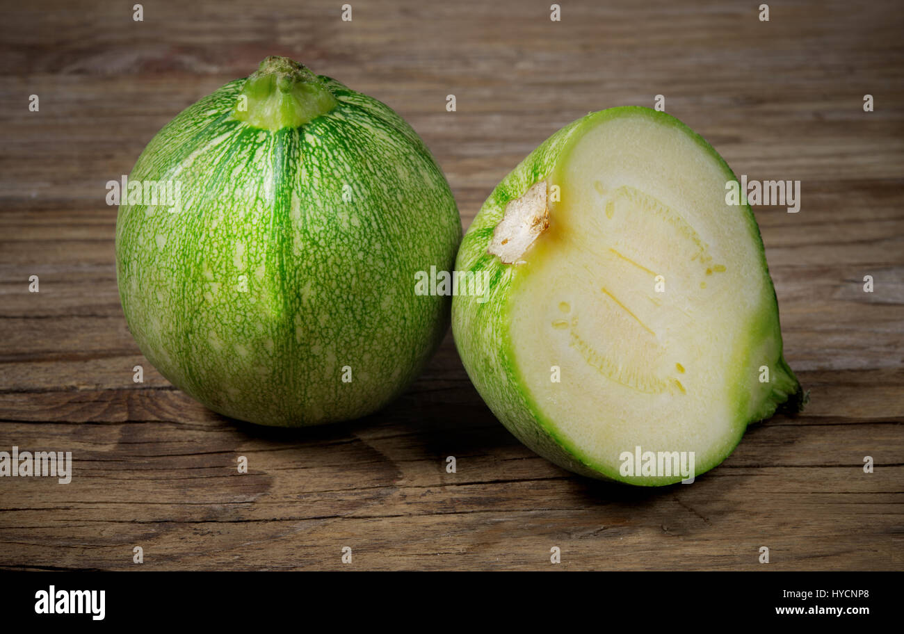 round courgettes zucchini on white background Stock Photo - Alamy
