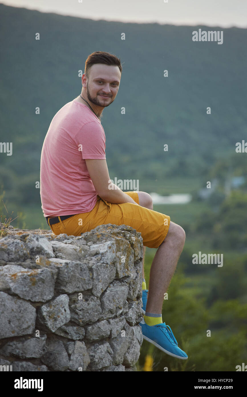 Young man smiling and enjoying sunny summer day Stock Photo - Alamy