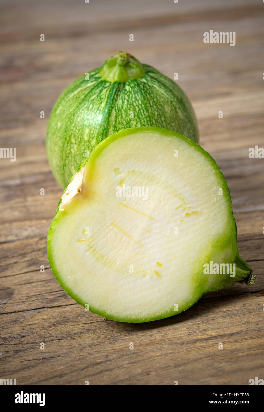 round courgettes zucchini on white background Stock Photo - Alamy