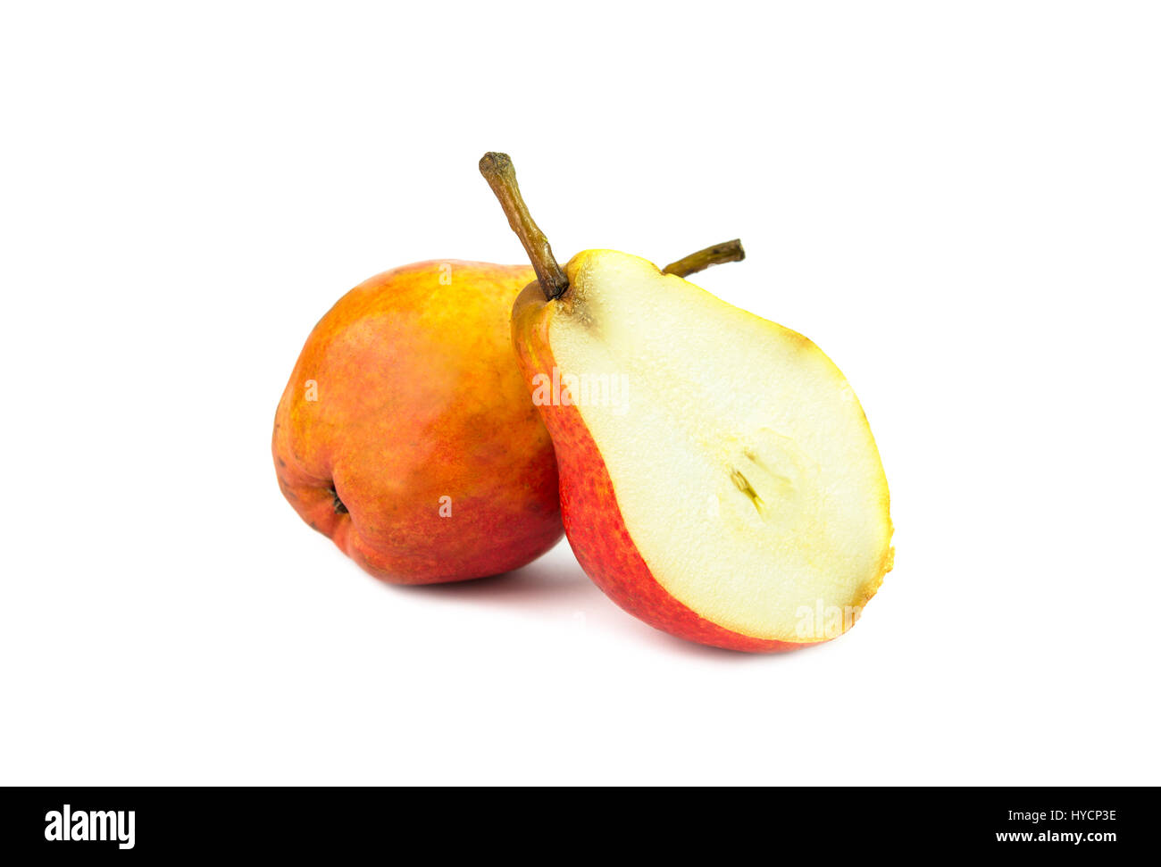 red pears sliced on white background Stock Photo - Alamy