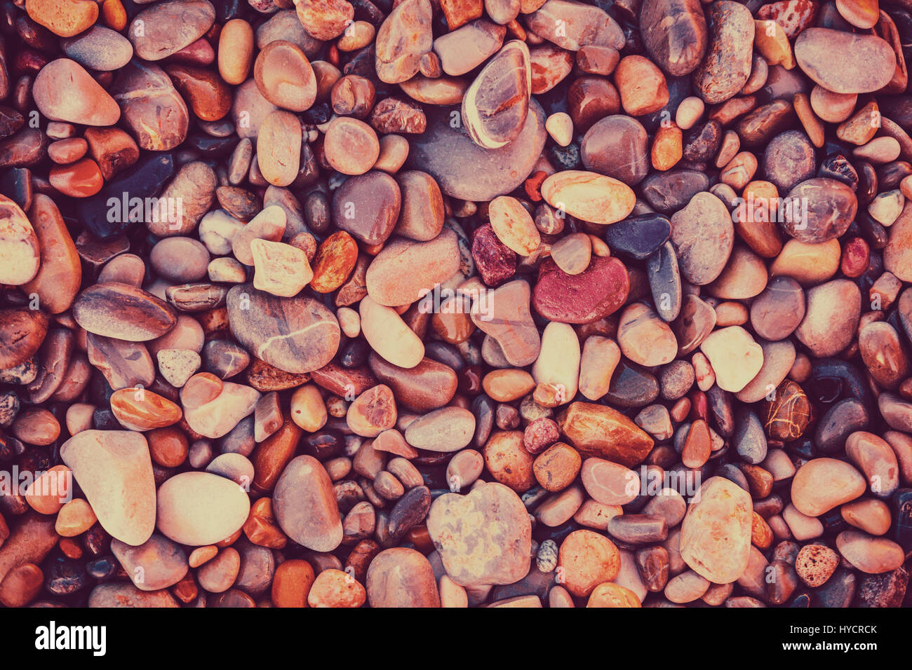 Natural vintage pebbles background in trendy rose color Stock Photo - Alamy