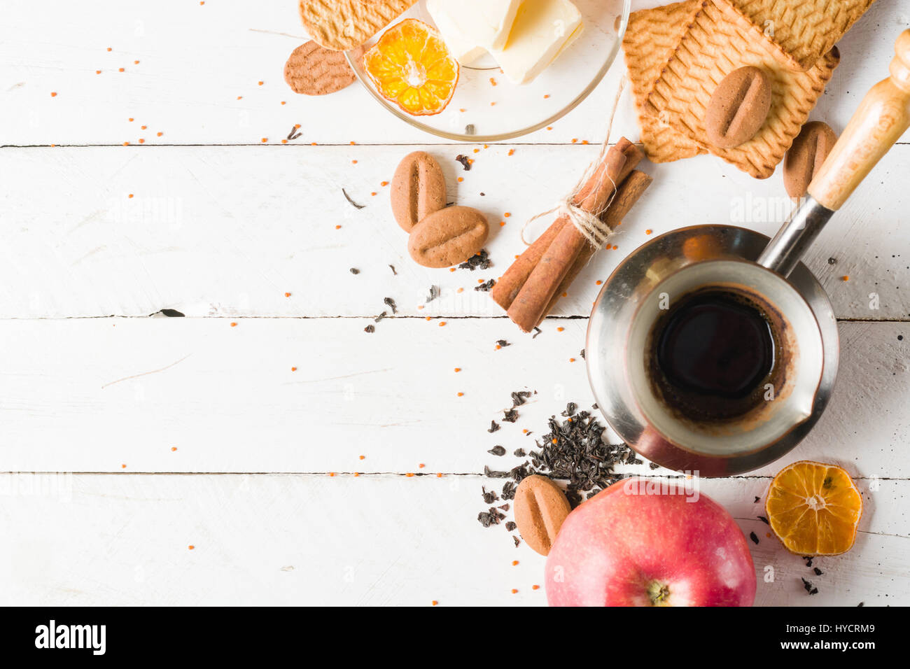 Morning tea with fruit and candied fruit. White wooden background and ...